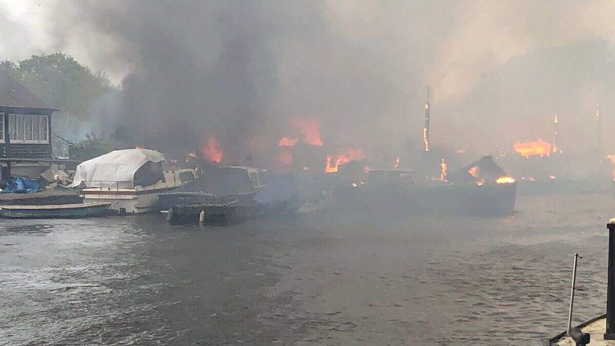 Dozens of firefighters tackle blaze on island in River Thames | Belfast ...