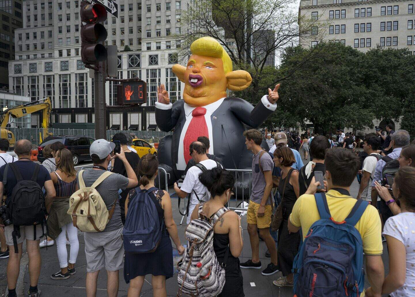 A giant inflatable rat that looks a lot like Donald Trump appears in ...
