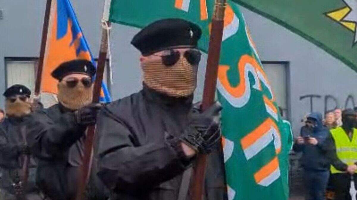 Masked Colour Party lead Saoradh parade in Derry | Belfast Telegraph