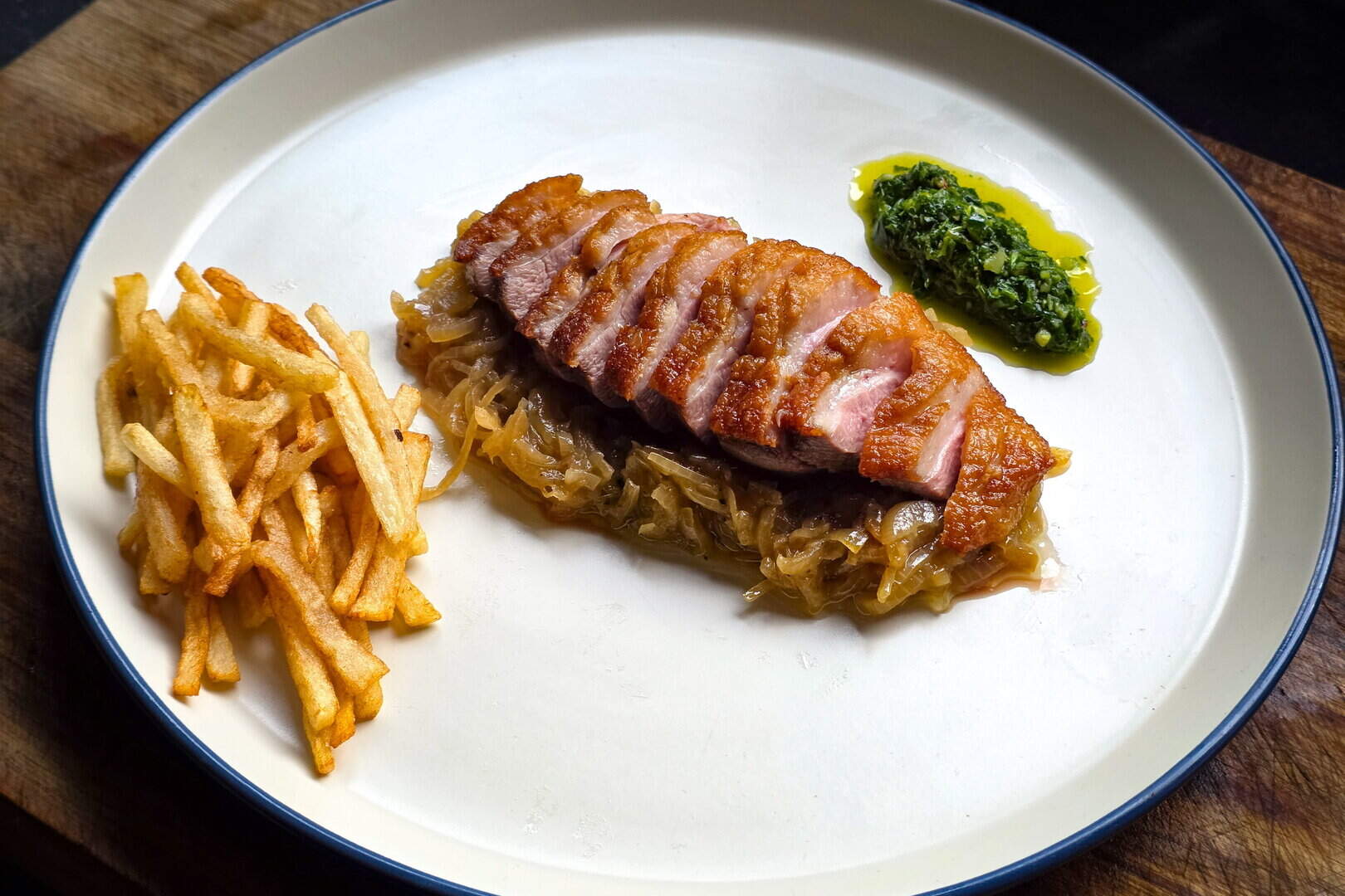 This crispy duck breast with confit onions and chimichurri packs a lot ...