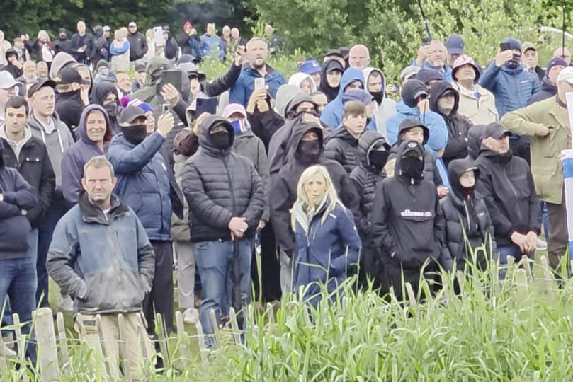 Carla Lockhart with masked men at Scarva protest sparks outrage ...
