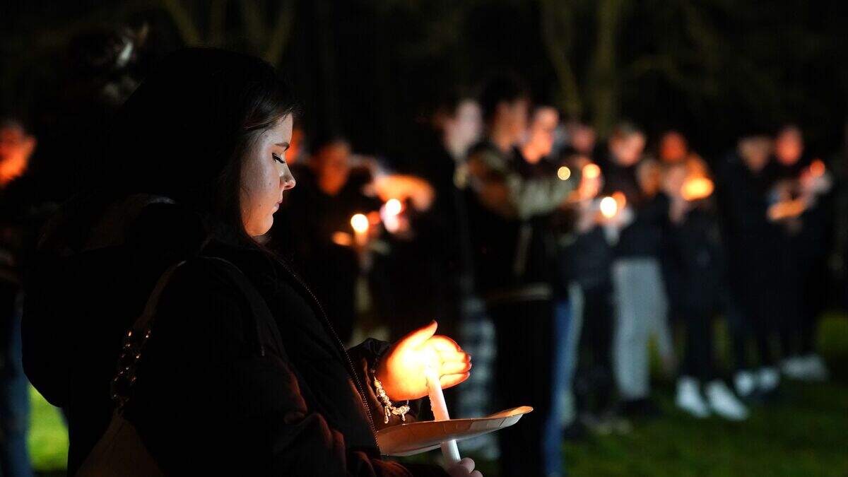Candlelit vigil held for girl, four, who was mauled to death by pet dog ...