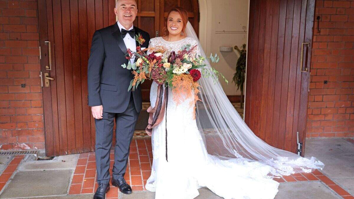 Frank Mitchell on cloud nine as he walks only daughter Laura down aisle ...