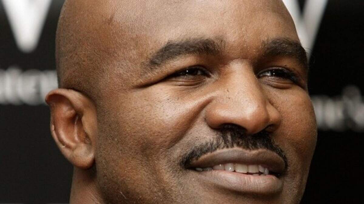 Evander Holyfield hit me, says wife | Belfast Telegraph