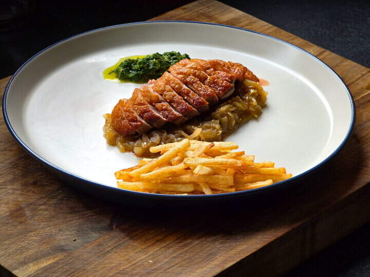 This crispy duck breast with confit onions and chimichurri packs a lot ...
