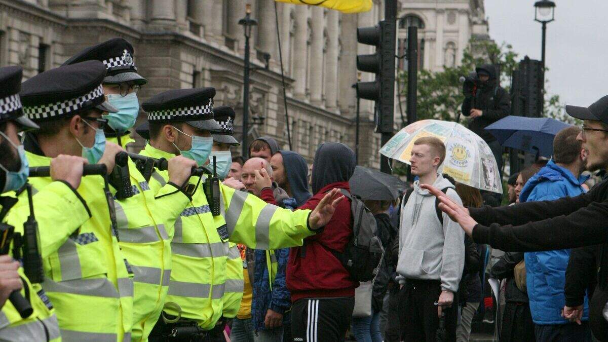 Police officers injured and 14 arrests made during anti-lockdown ...