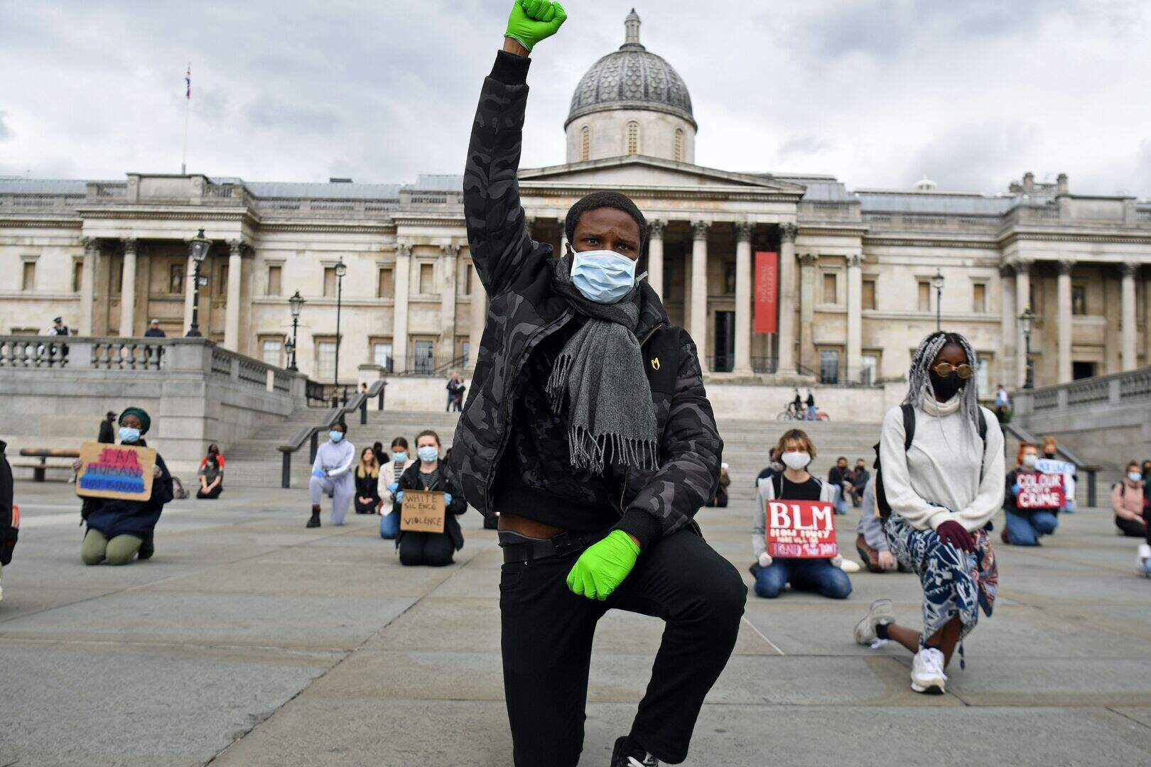 Protesters take the knee in Trafalgar Square tribute to George Floyd ...