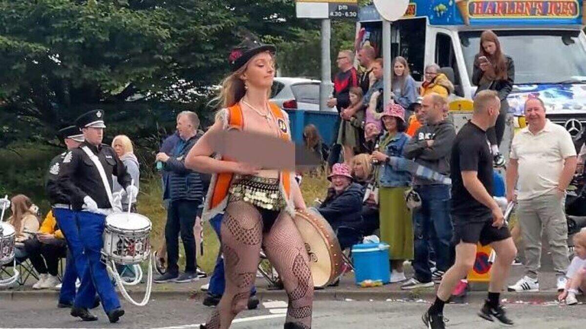 Woman flashes shocked onlookers during Belfast Twelfth parade | Belfast ...