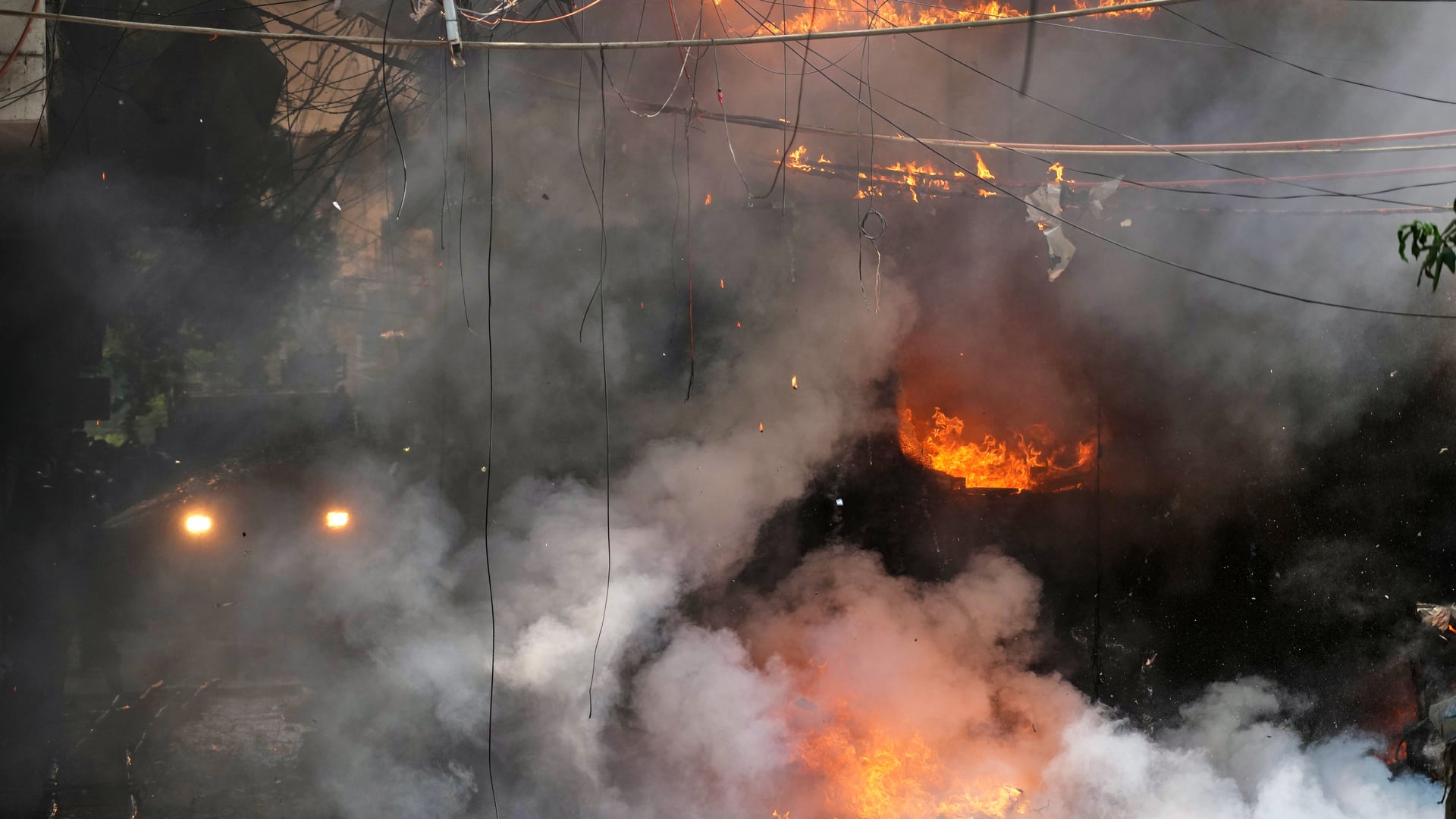 At least 18 people killed as fire sweeps through building in New Delhi ...