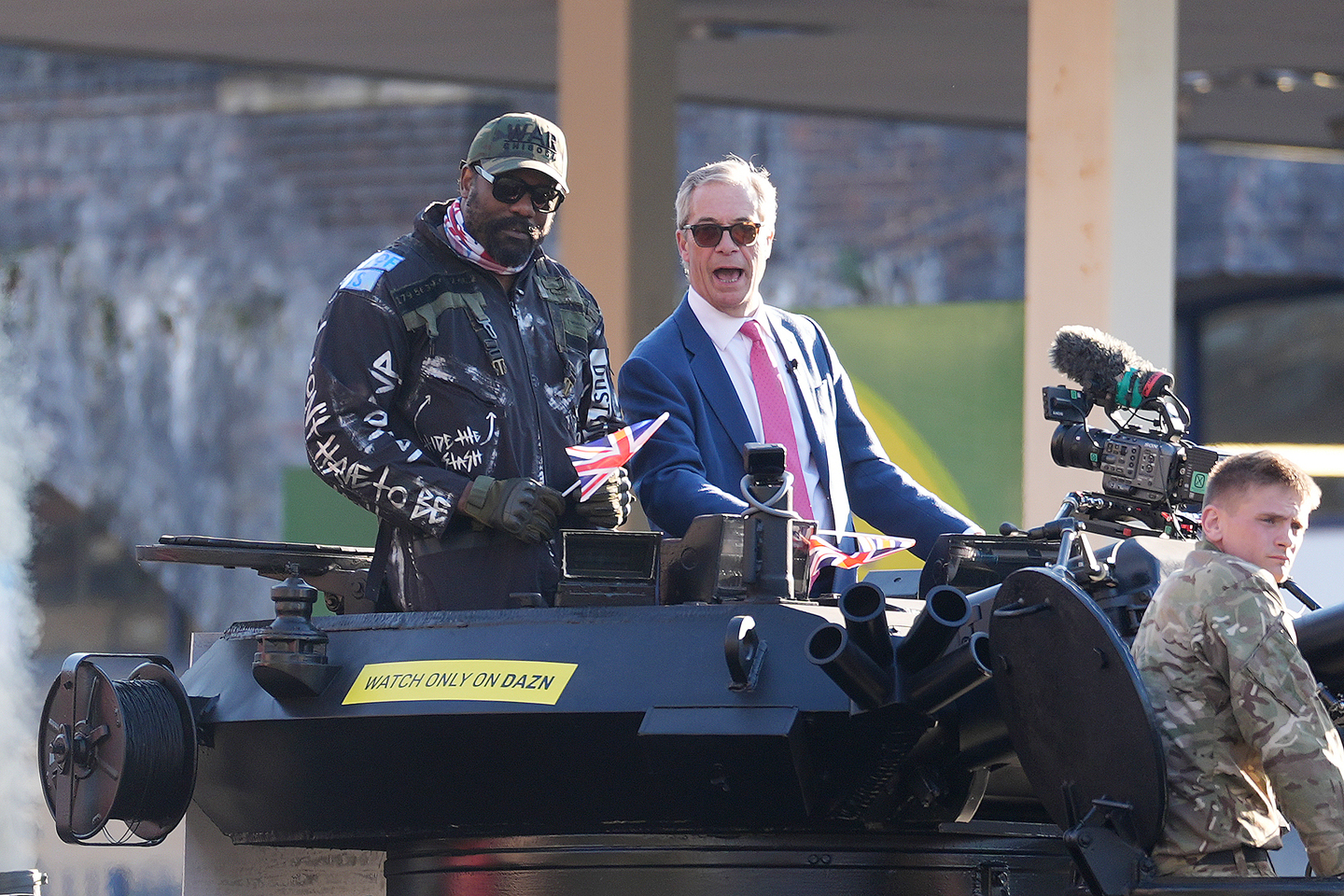 Derek Chisora arrives at media event in army tank with Nigel Farage ...